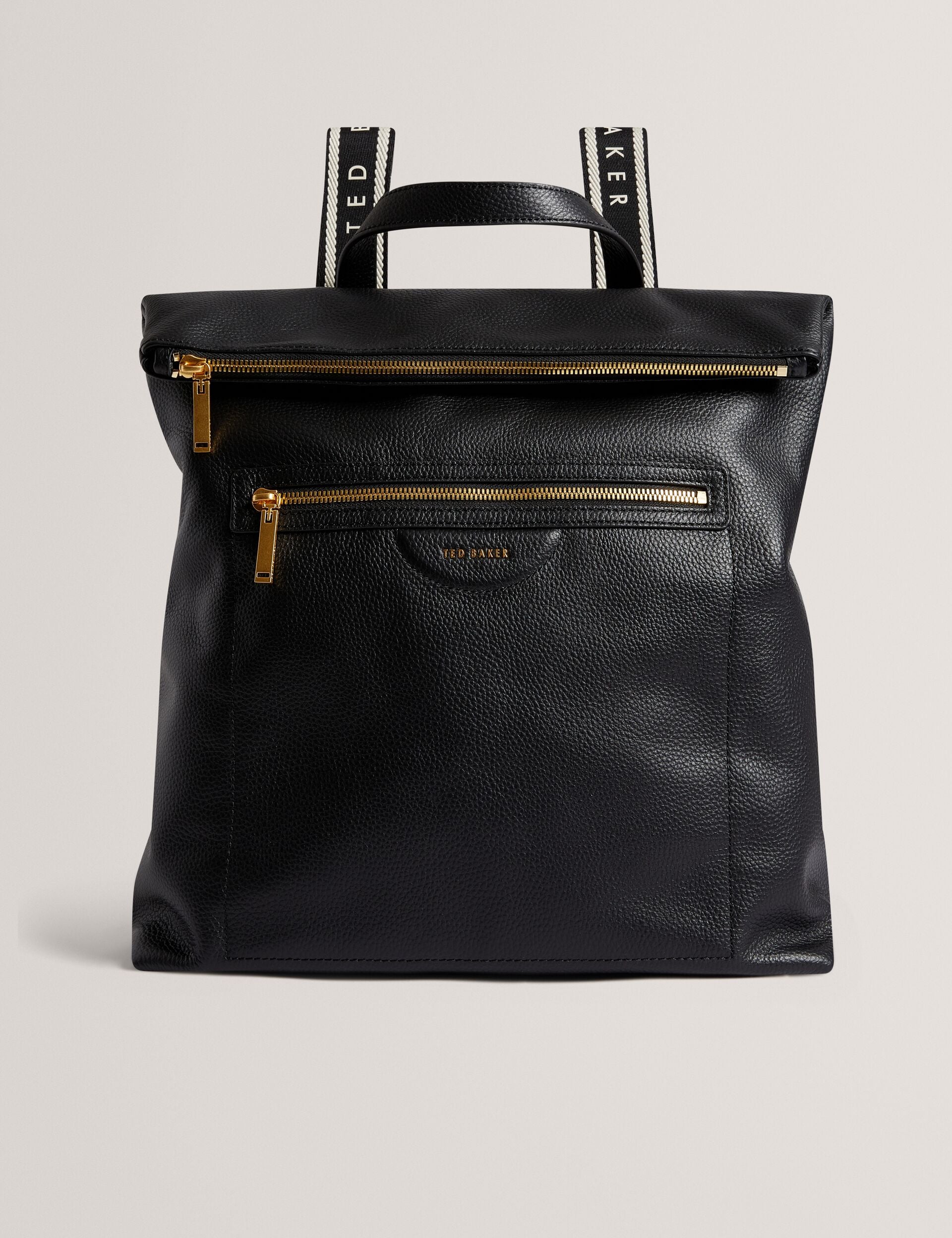ESSAYA - Webbing Strap Black Leather Fold Over Backpack